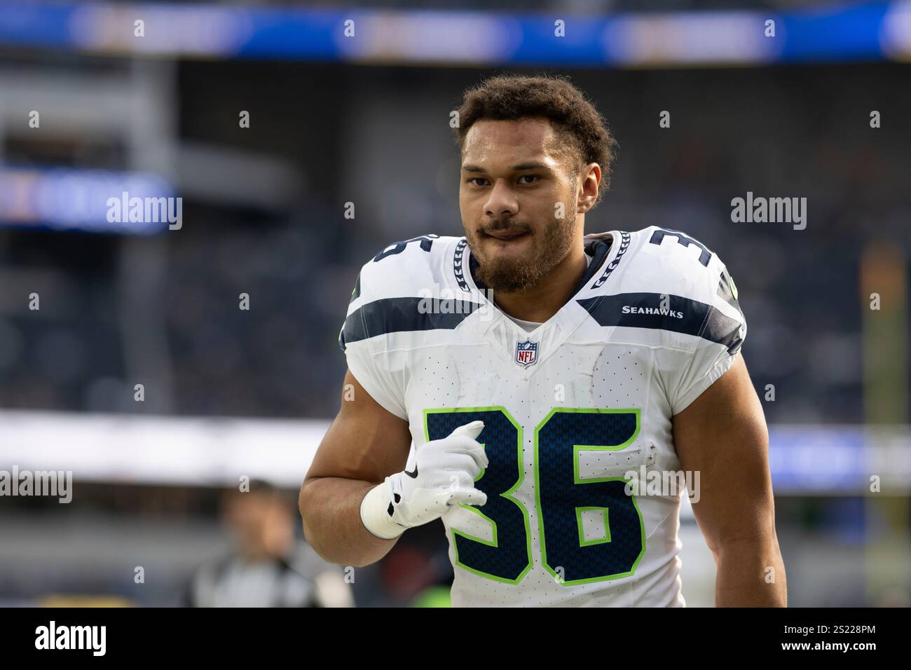 Seattle Seahawks running back George Holani (36) jogs back to the ...