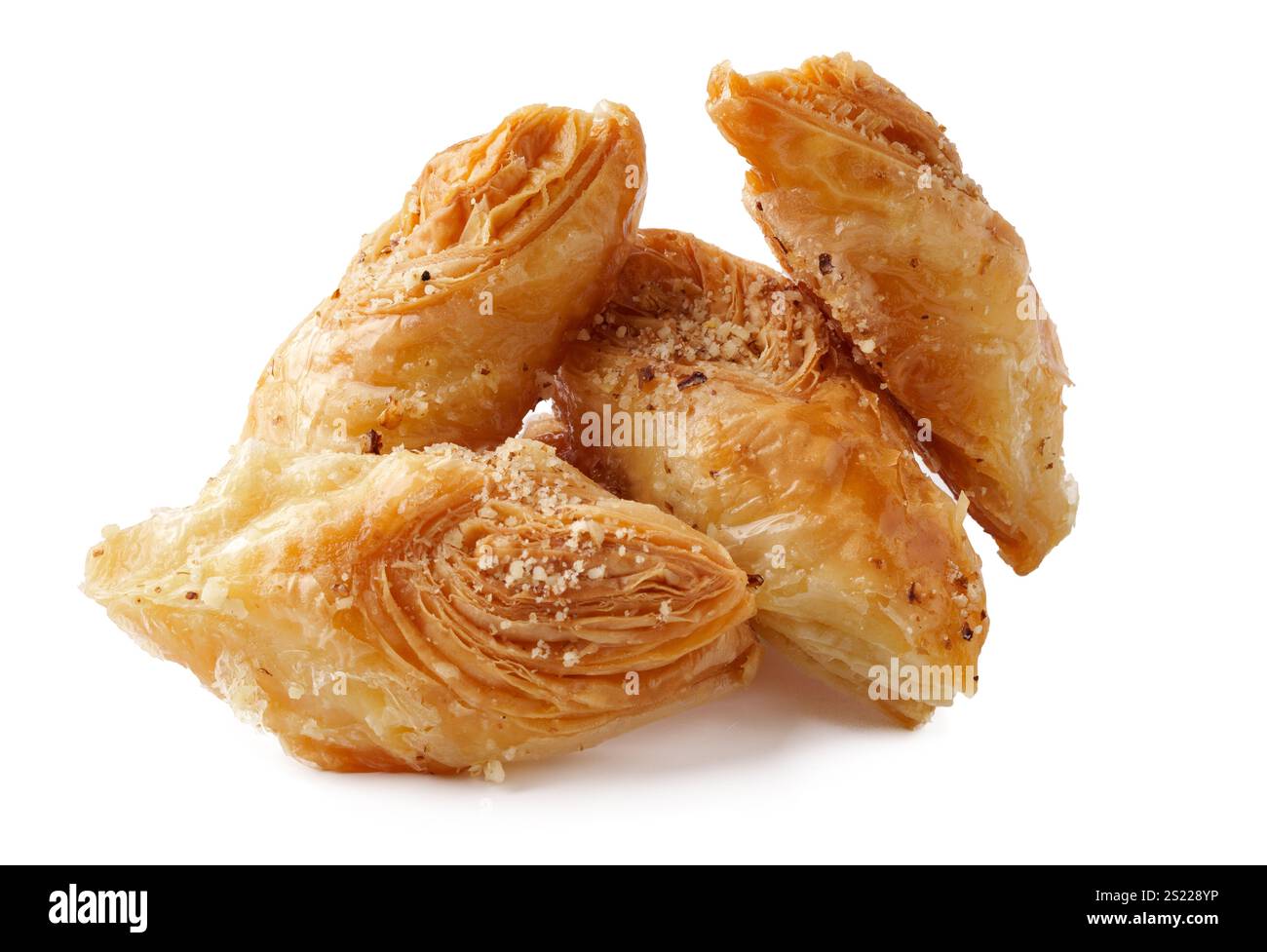 Delicious flaky pastry with layers and nuts served on a clean surface ...