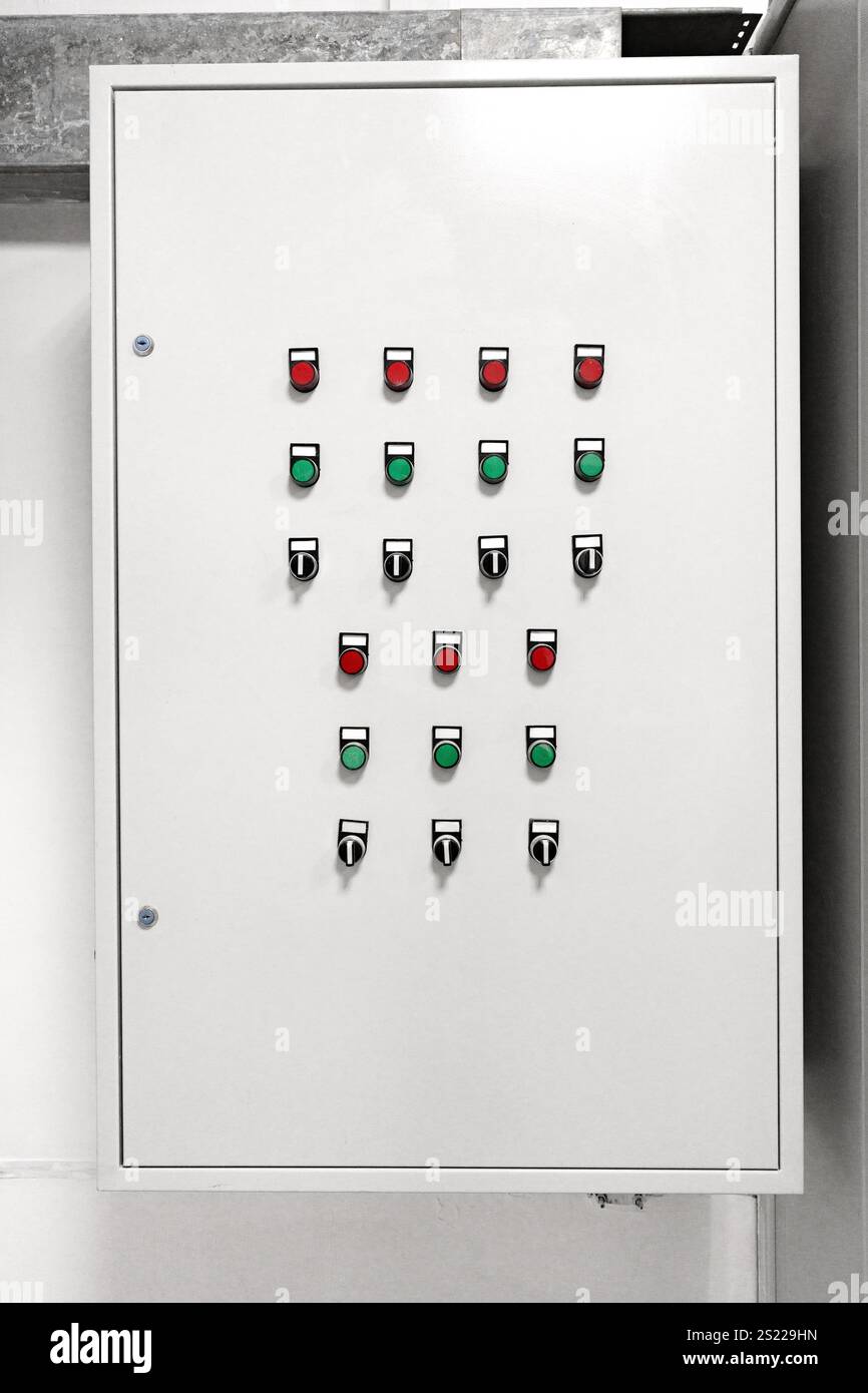 Control panel with multiple switches and indicators located in a modern ...