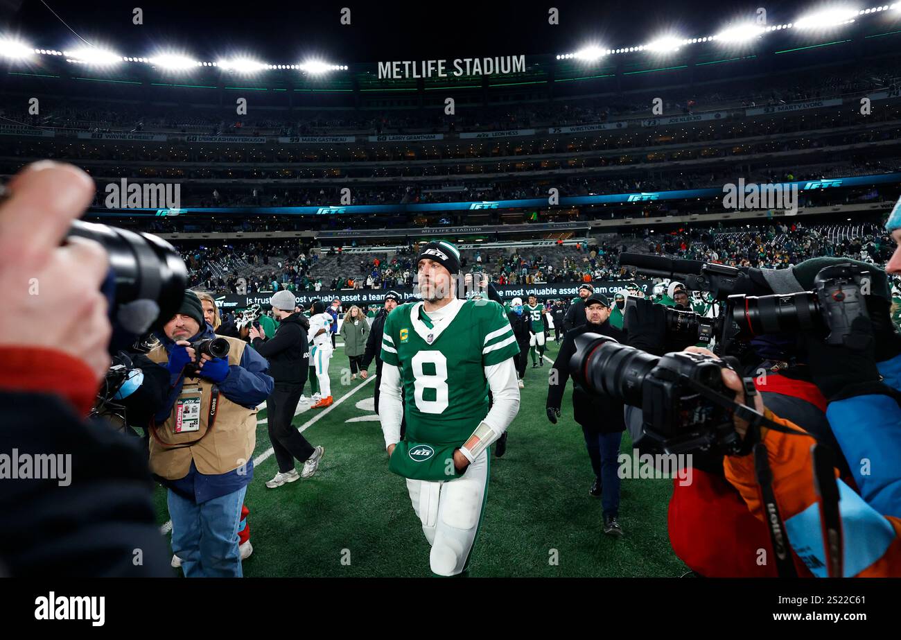 New York Jets quarterback Aaron Rodgers (8) leaves the field after an ...