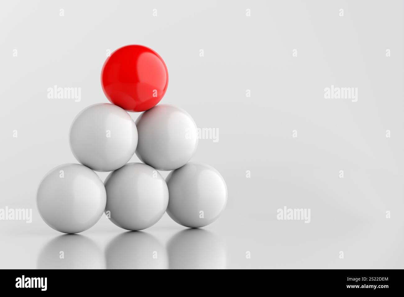 Red sphere stands out among white spheres, symbolizing leadership ...