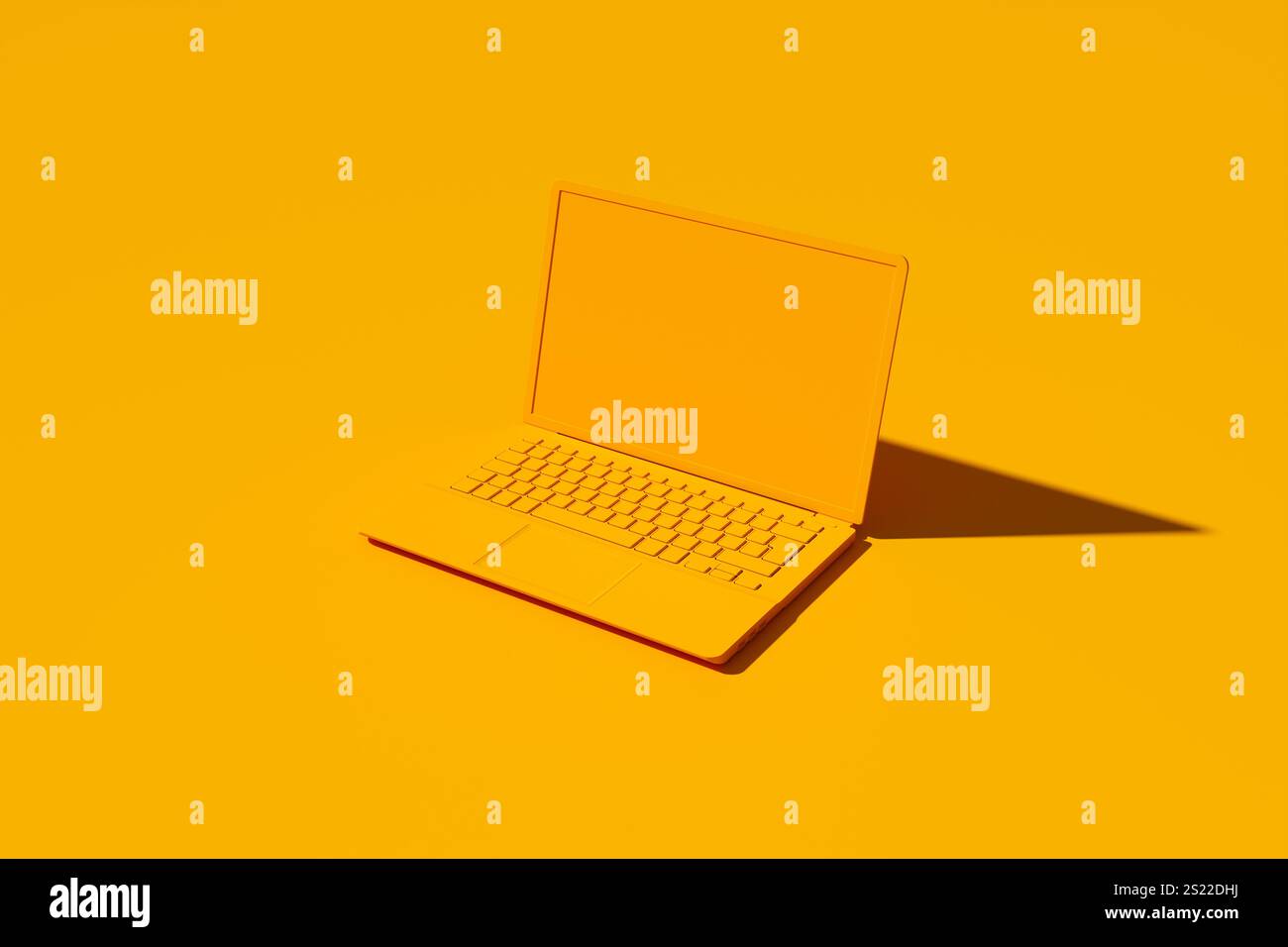 Technology and freelance work concept. Yellow laptop computer casting a ...