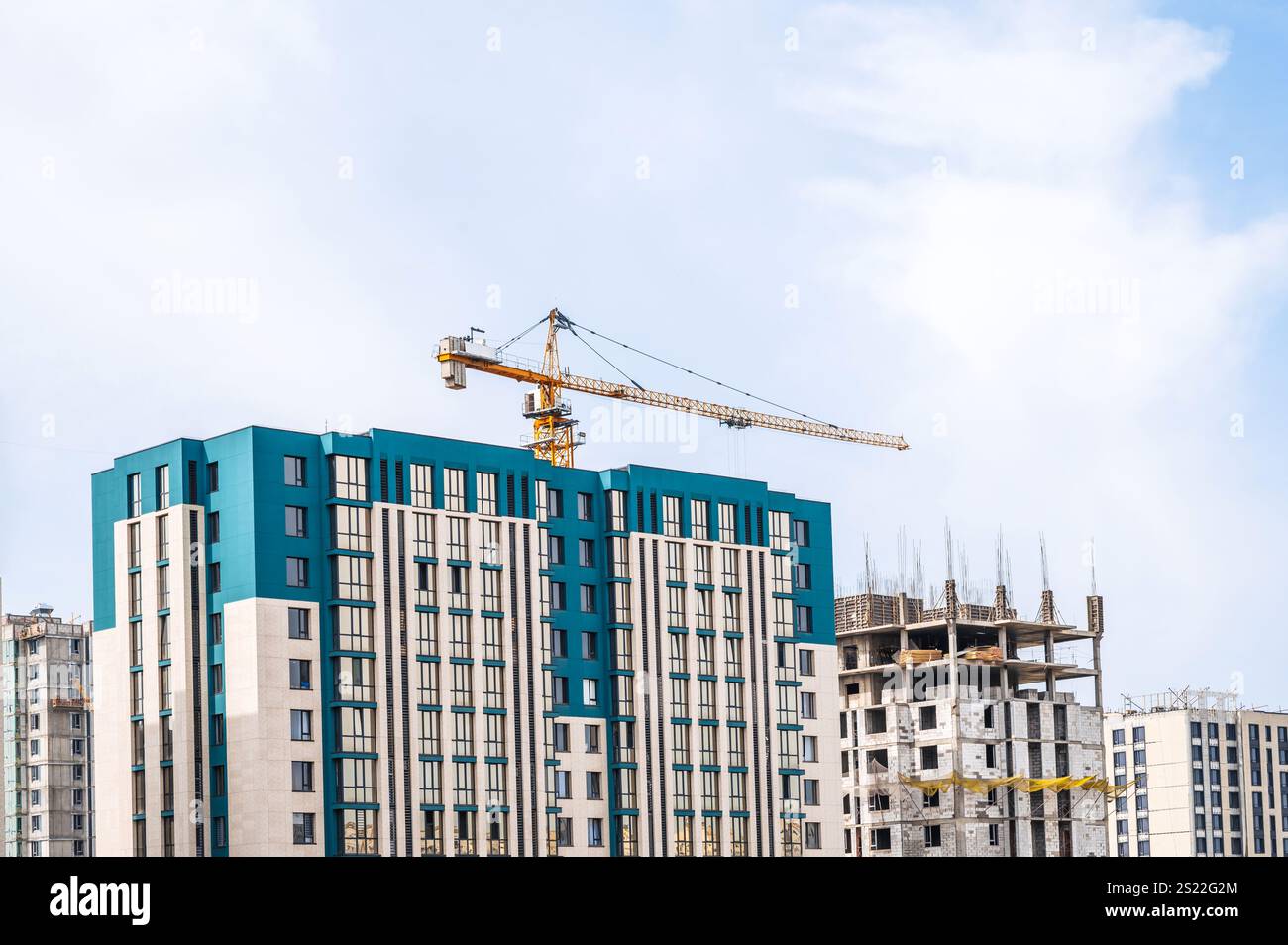 Tower crane in action to build multi-storey residential building Stock ...