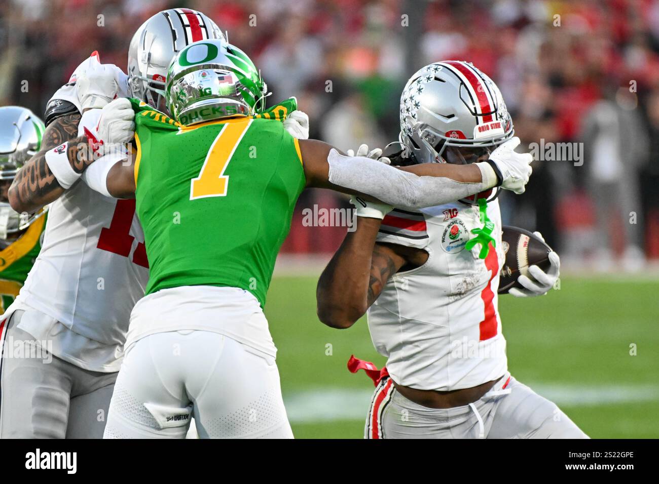 Oregon Ducks defensive back Jabbar Muhammad (7) grabs the face mask of ...