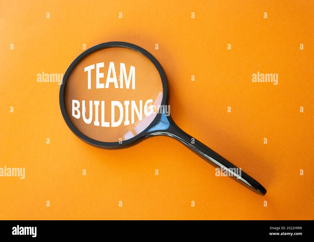 Team Building symbol. Concept word Team Building on magnifying glass ...