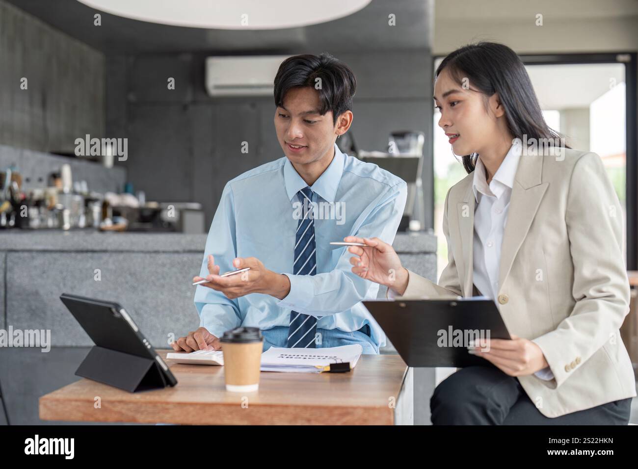 Strategic brainstorming session business team meeting over coffee ...