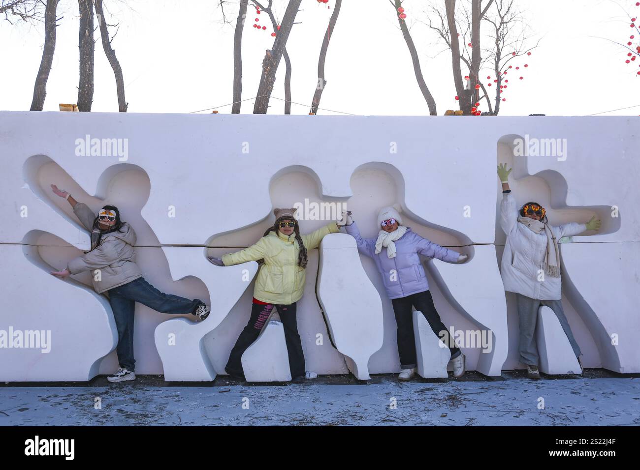 Tourists enjoy winter time at an ice and snow park in Shenyang City ...