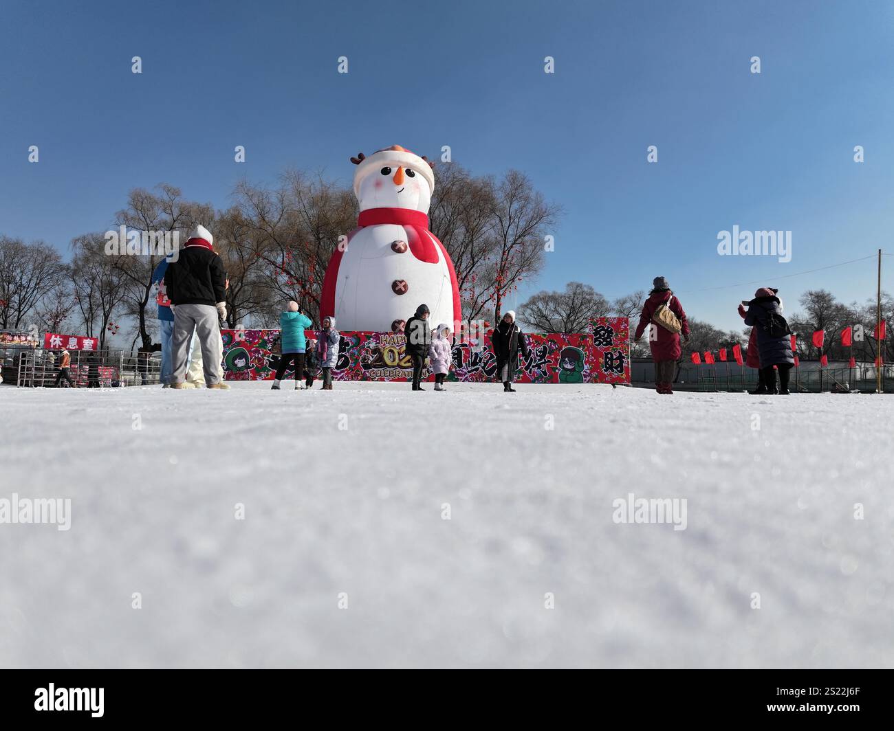 Tourists enjoy winter time at an ice and snow park in Shenyang City ...