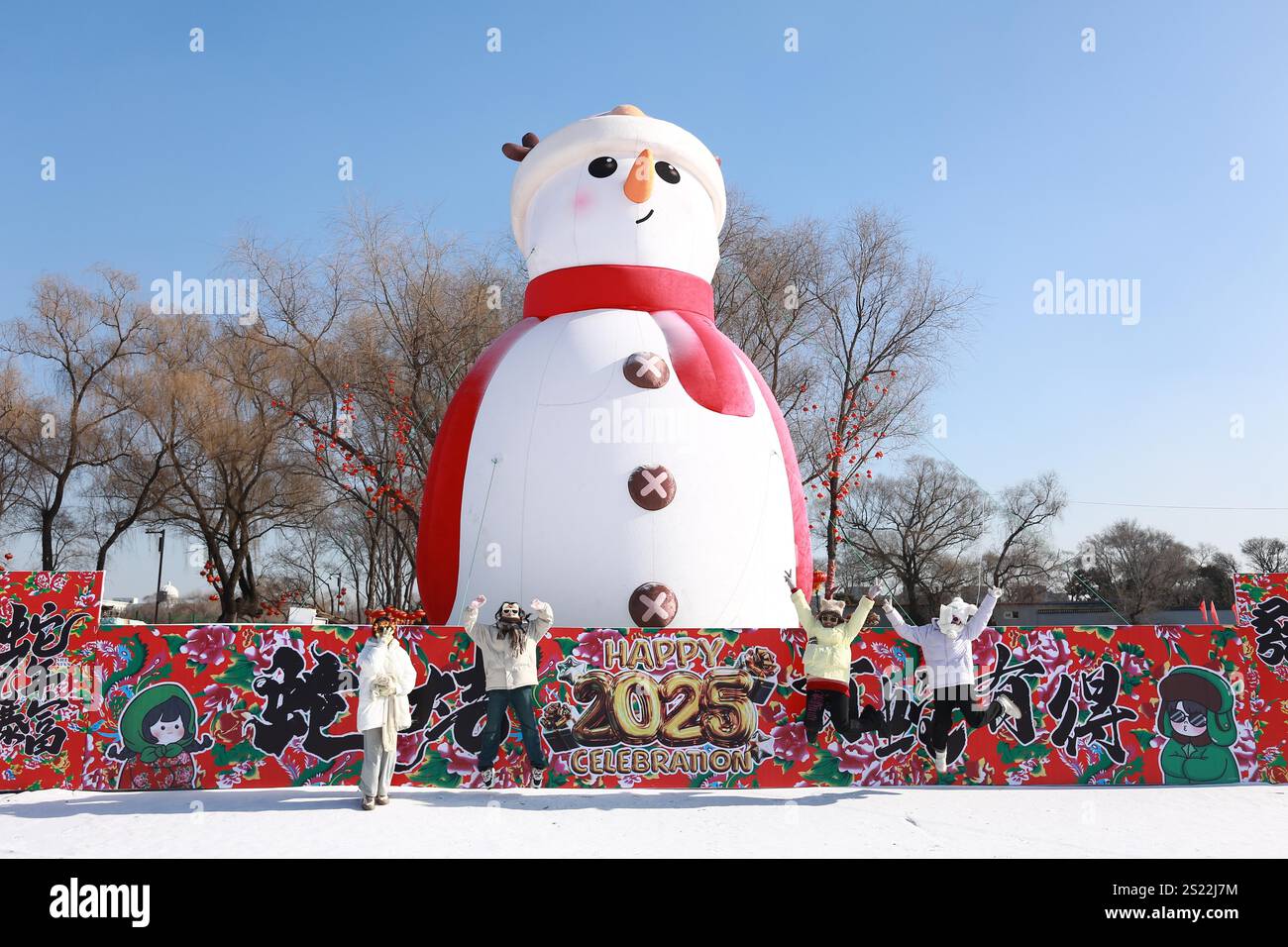 Tourists enjoy winter time at an ice and snow park in Shenyang City ...