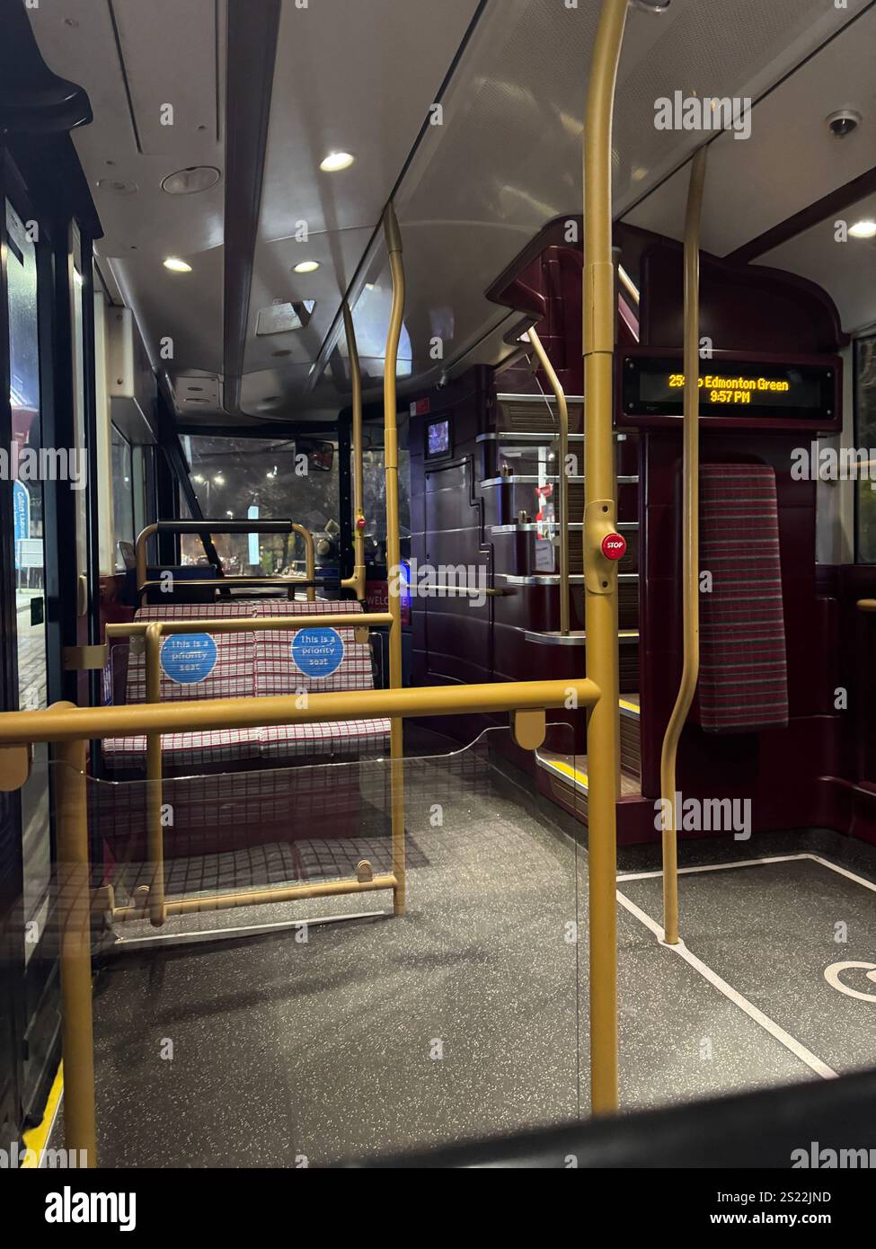The (empty) interior of a London bus, showing its classic red ...