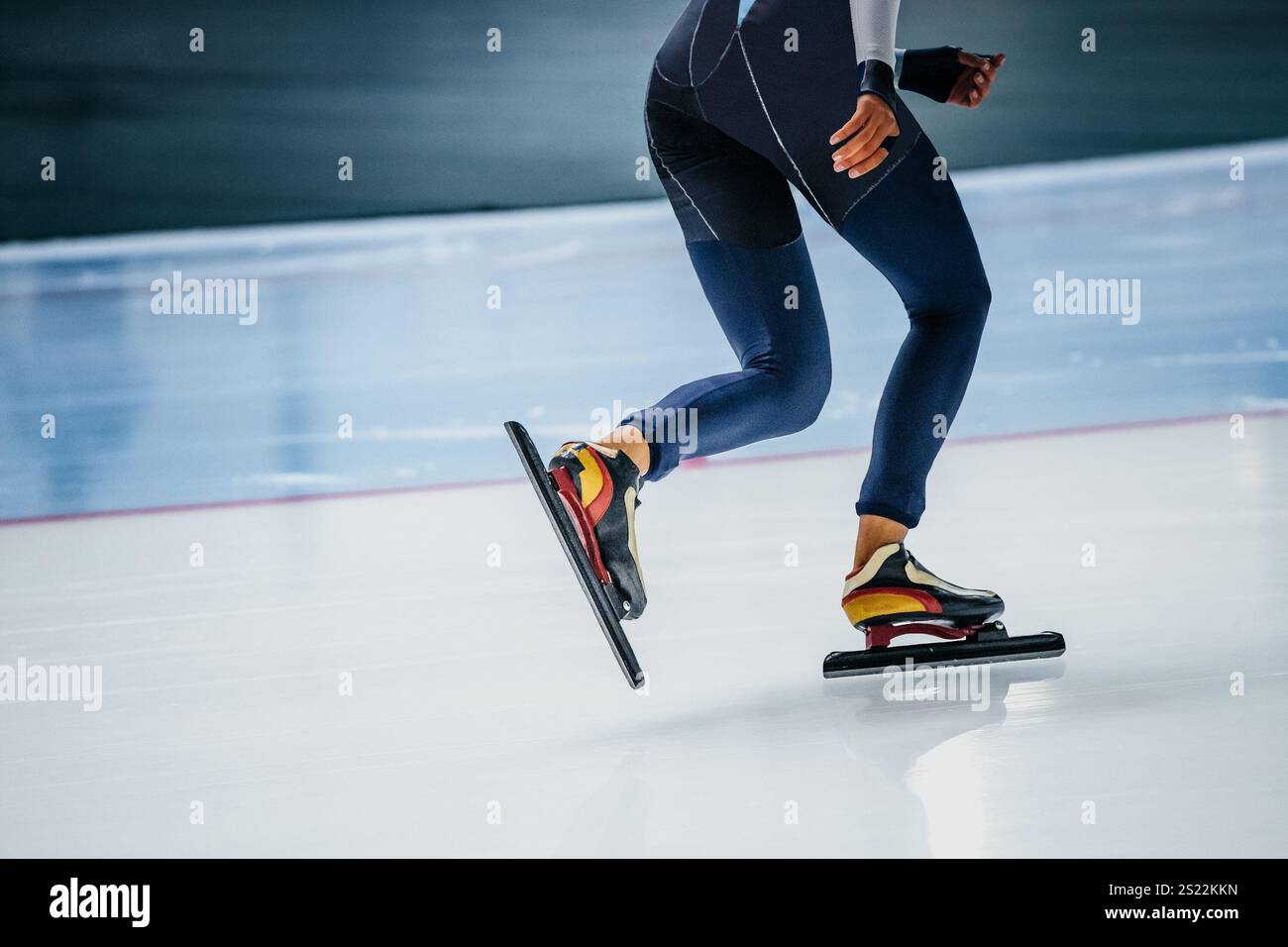 legs female speed skater in dark blue skin suit and skates Stock Photo ...
