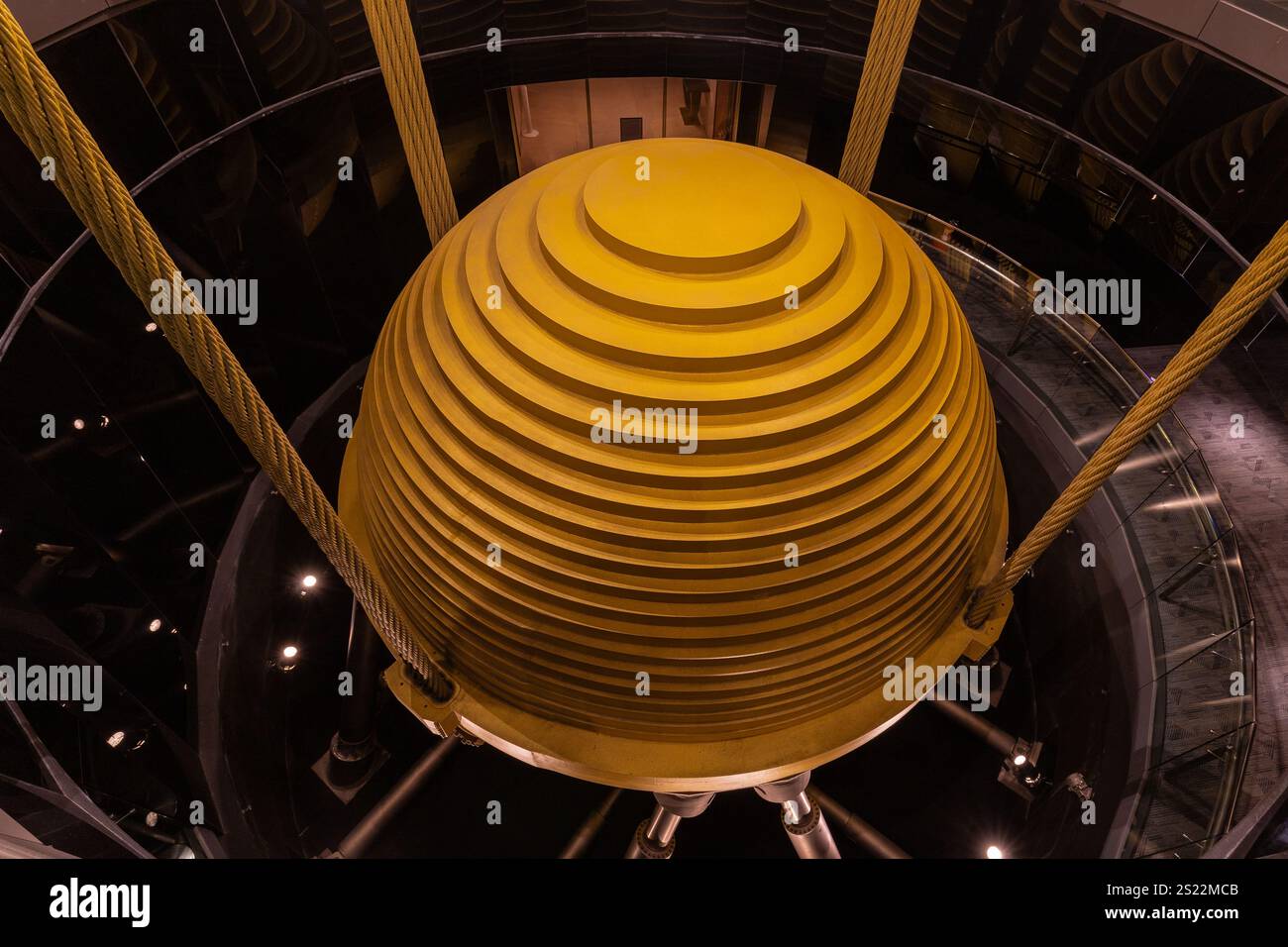 steel pendulum that serves as a tuned mass damper inside the Taipei 101 ...
