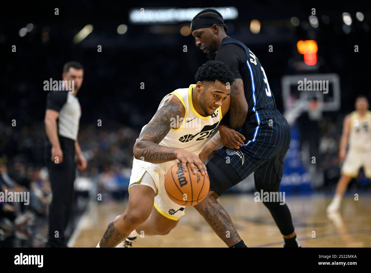 Utah Jazz forward Brice Sensabaugh (28) is defended by Orlando Magic ...