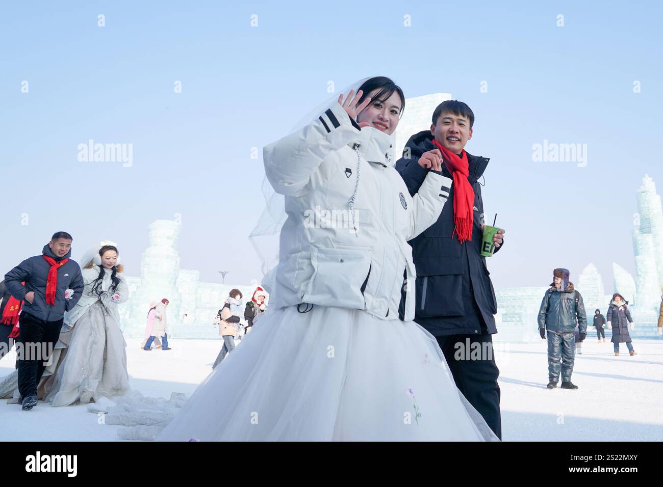 Harbin,China.6th January 2025. Newly-wed couples holding the mascots ...