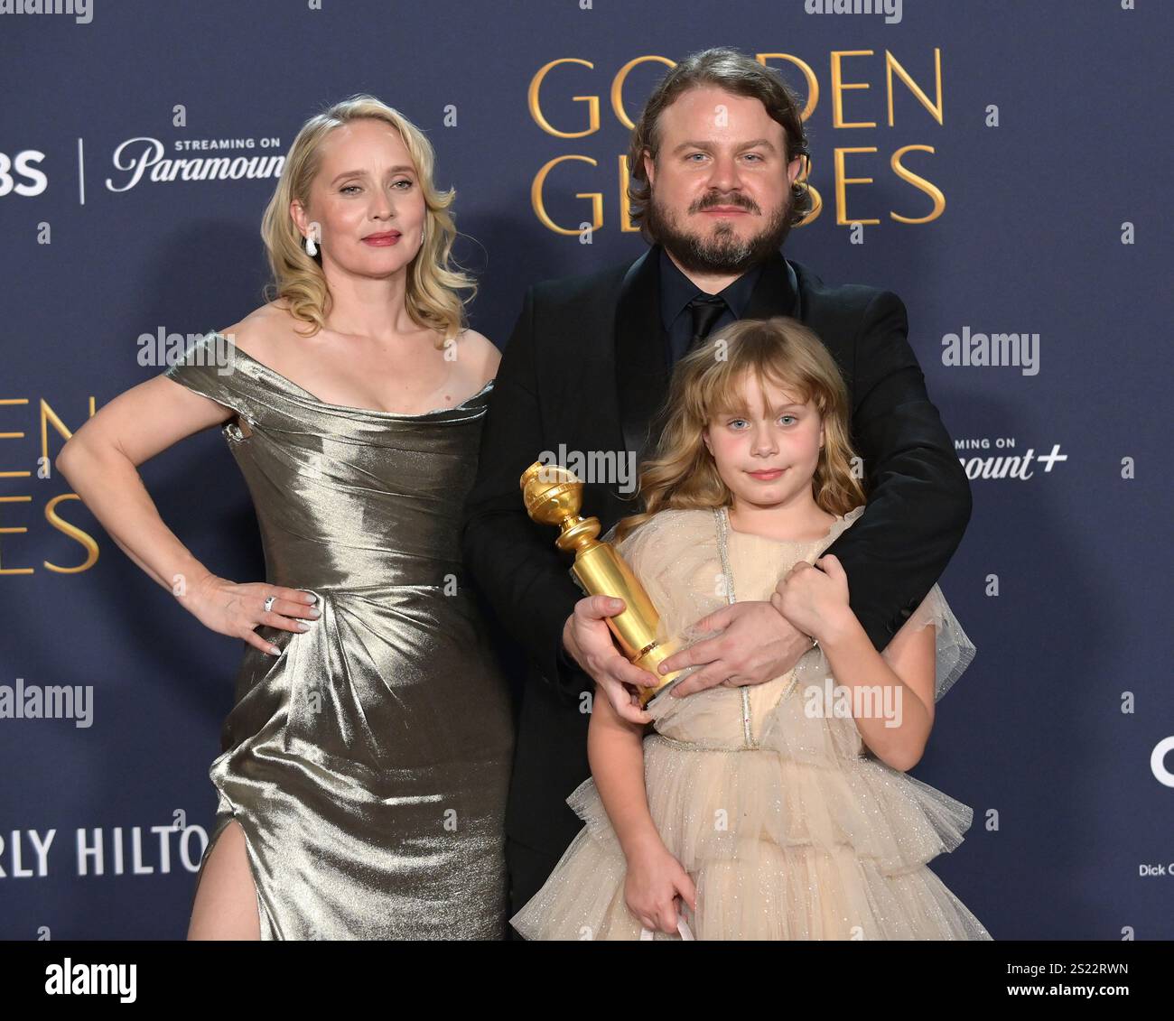 Brady Corbet, Mona Fastvold and daughter Ada in the press room at the 82nd Annual Golden Globe ...