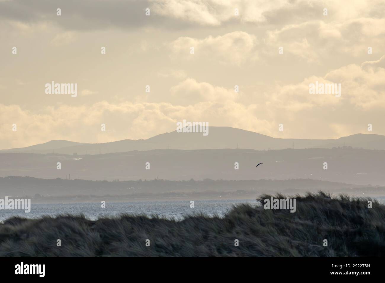 Formby Beach at Sunset looking out over the Welsh Hills Stock Photo - Alamy