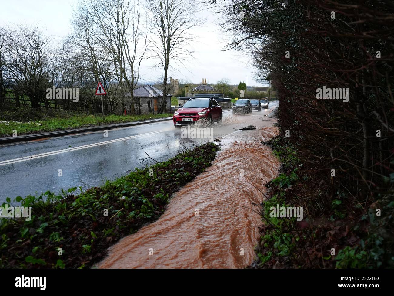 Motorists drive through standing water in Severn Stoke in ...