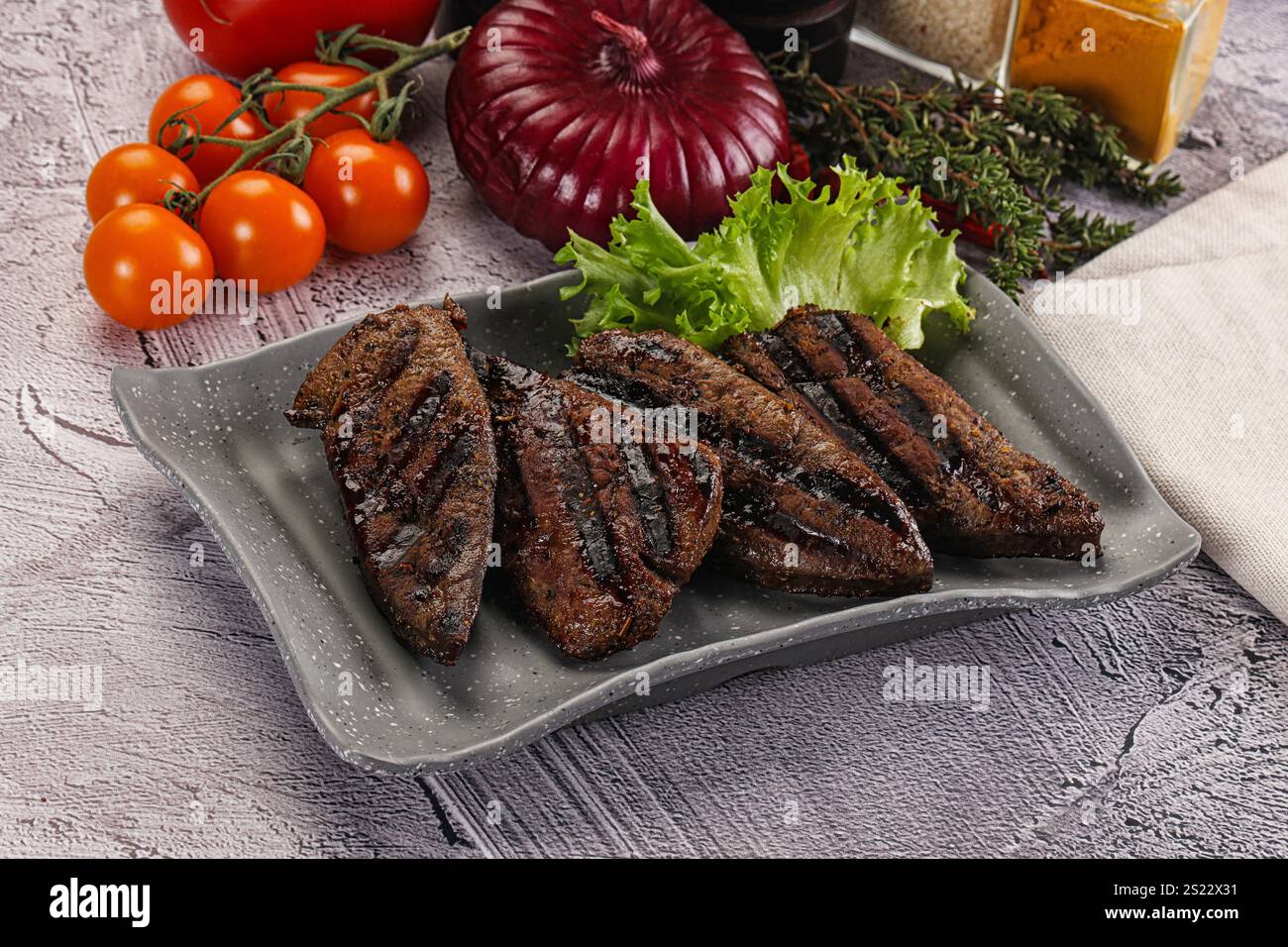 Grilled diet beef liver steak in the plate Stock Photo - Alamy