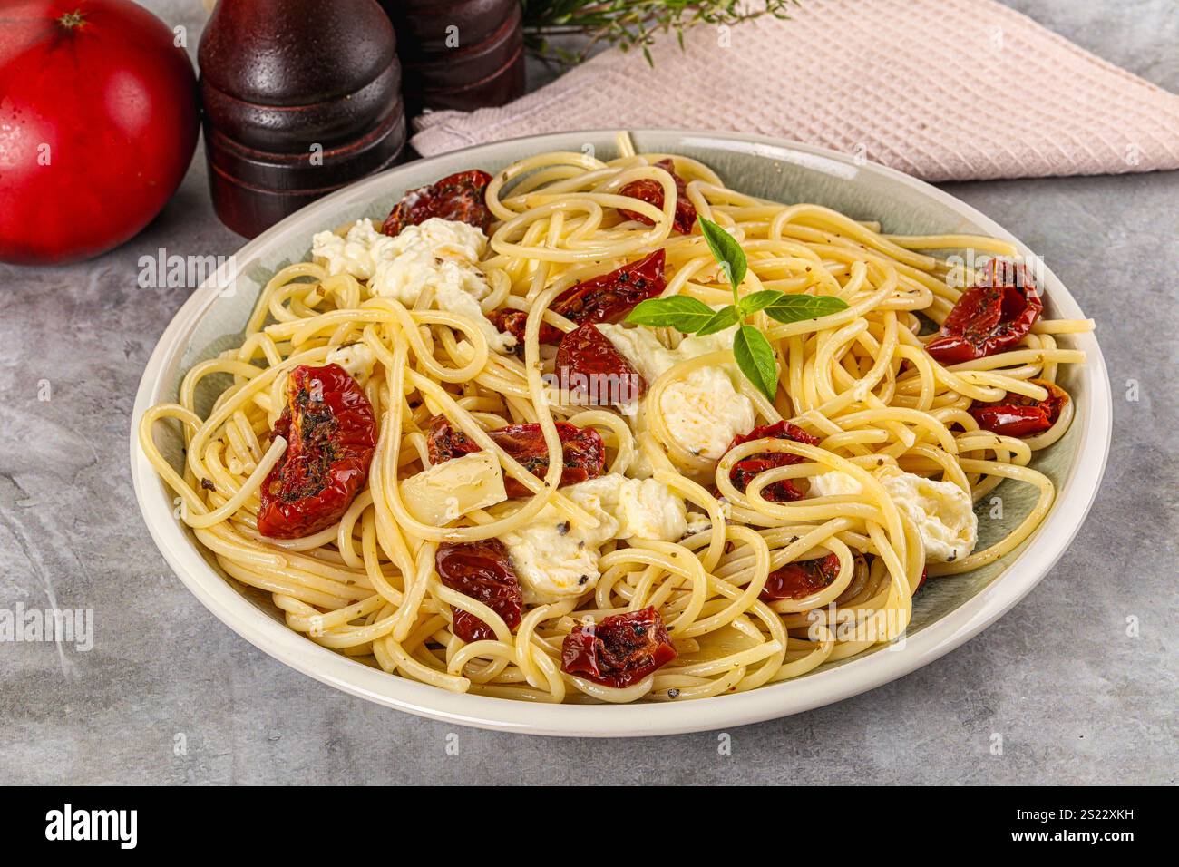 Italian pasta spaghetti with stracciatella and tomato Stock Photo - Alamy