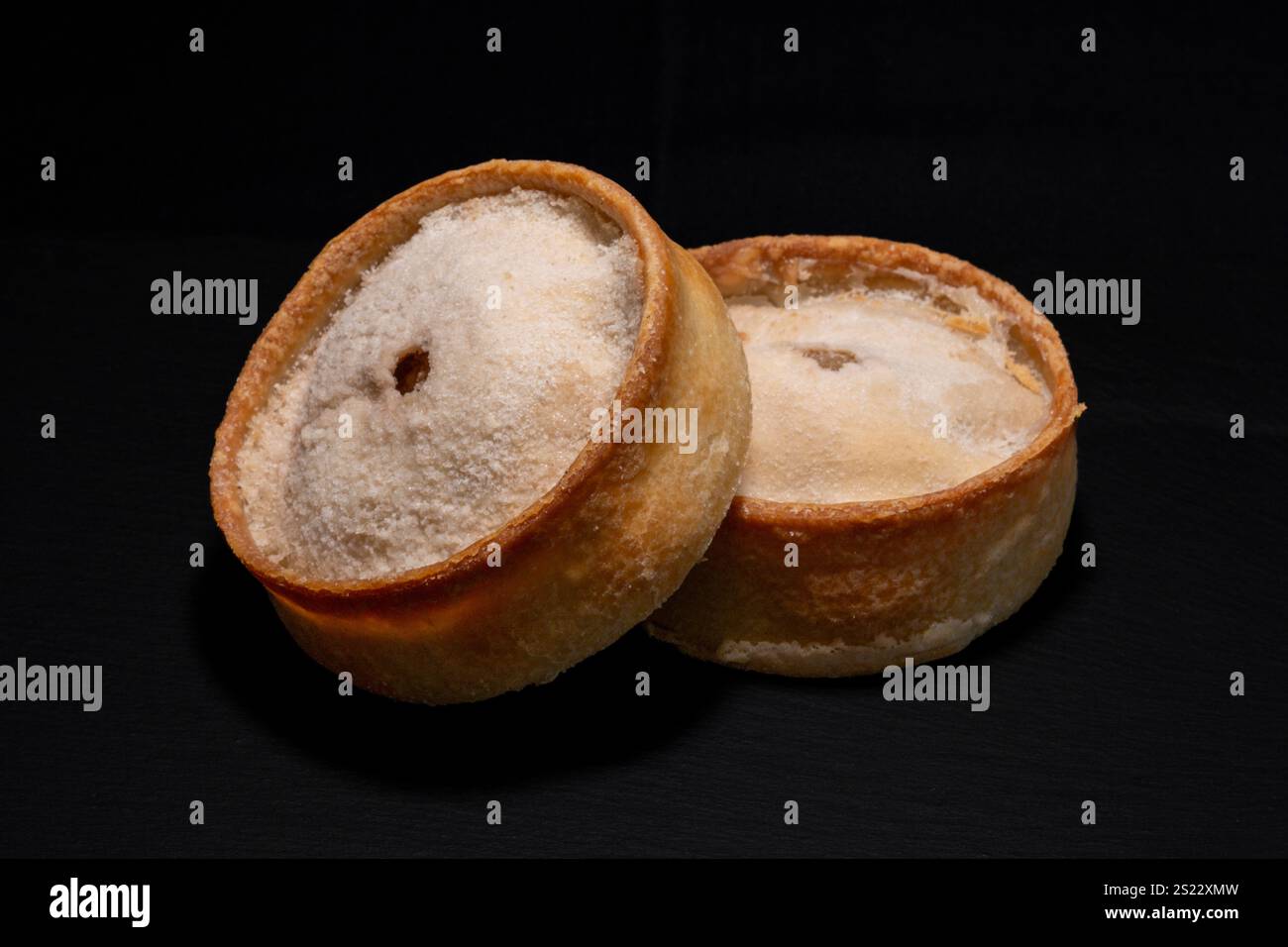 Two Scotch Pies with golden crust just out the oven and served on a ...