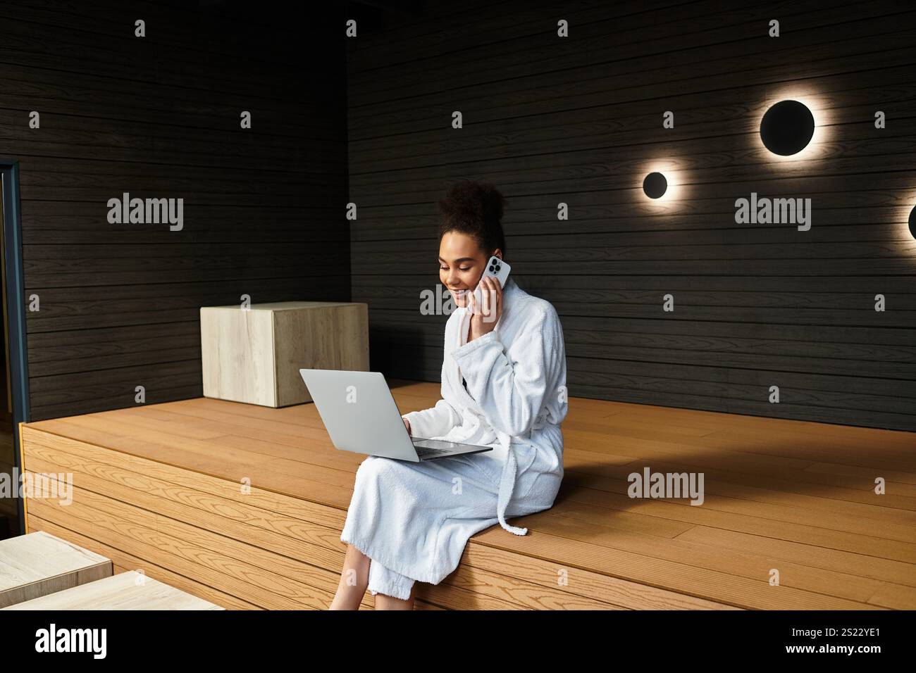 A young African American woman relaxes in a cozy spa setting, balancing ...
