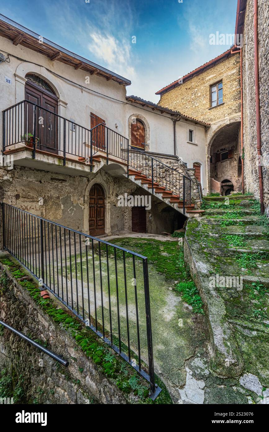 Old houses with moss growing on the outside staircase medieval village ...