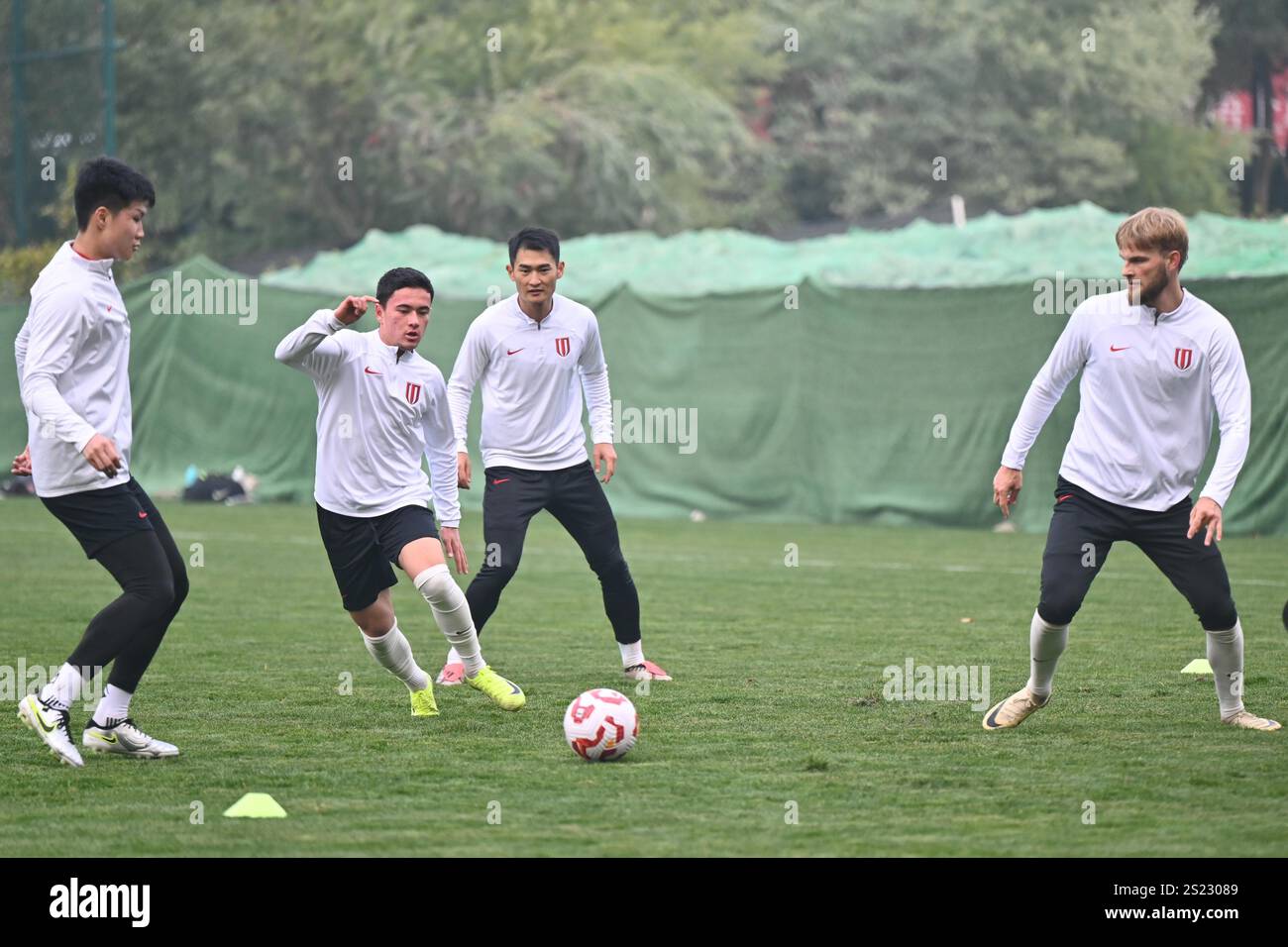 Players of Chengdu Rongcheng Football Club train for the new season in ...