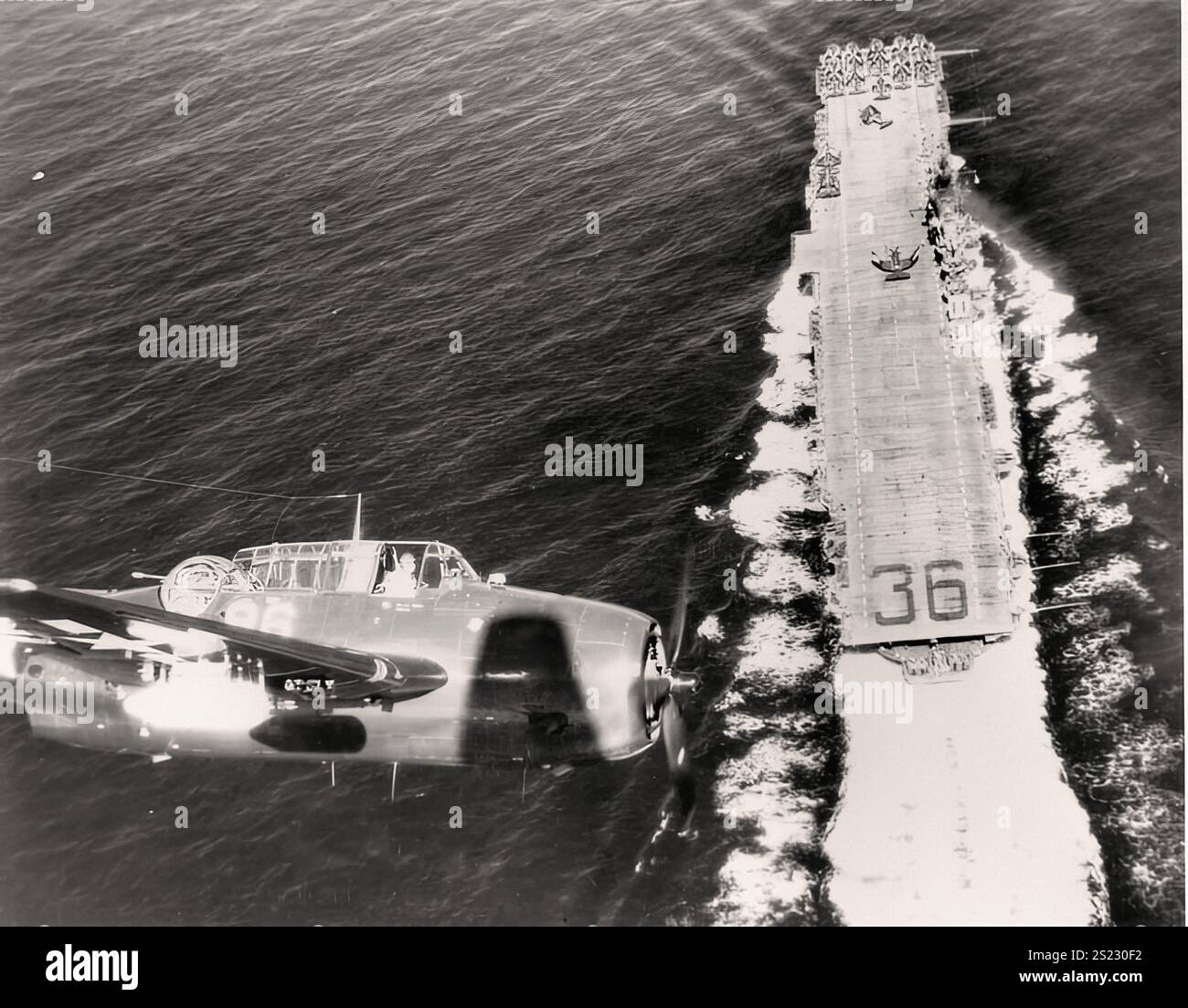 American torpedo Grumman TBM-3E «Avenger» flies over the aircraft ...