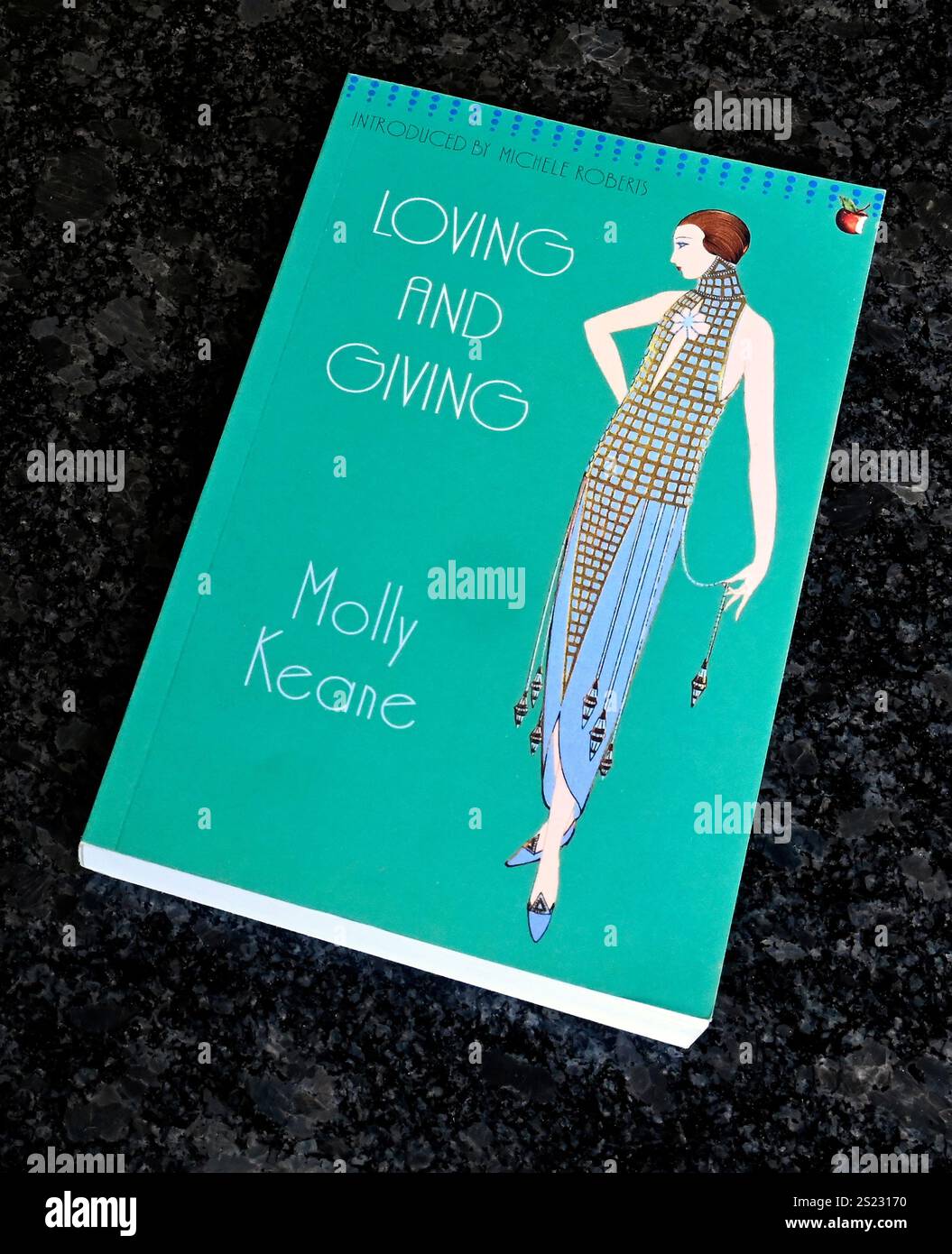 Book cover. "Loving and Giving" by Molly Keane Stock Photo - Alamy