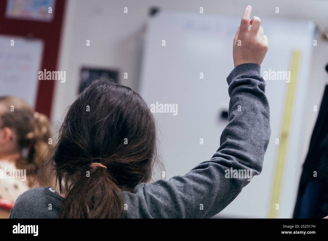 A pupil raise her finger/hand as France's Minister of Education, Higher ...