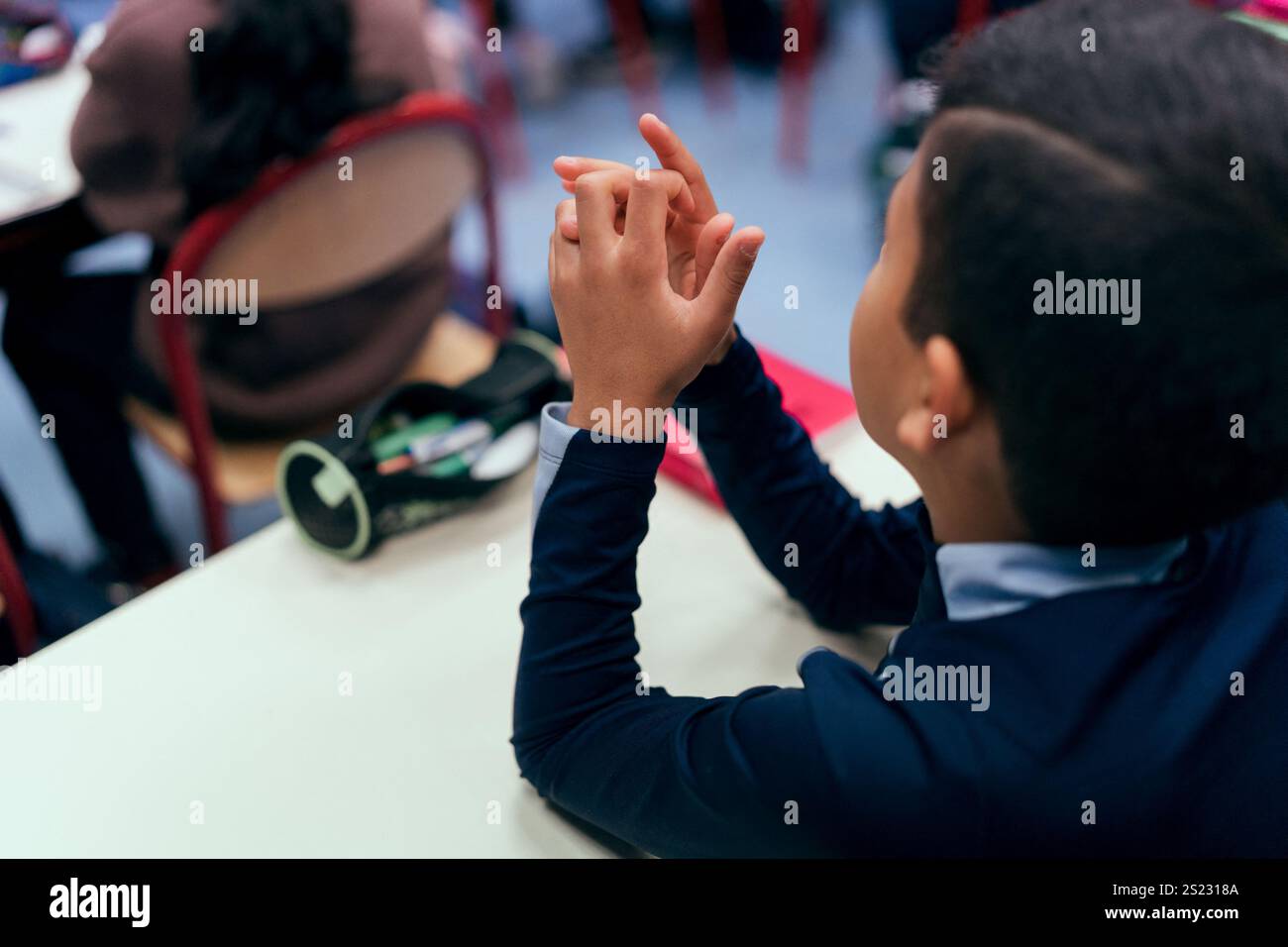 A pupil raise her finger/hand as France's Minister of Education, Higher ...