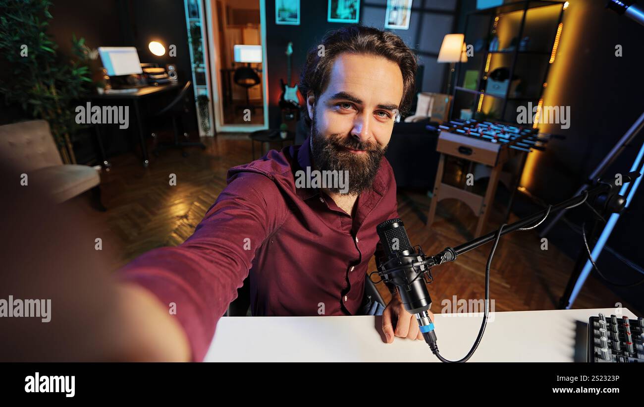 Upbeat content creator hosting online show in rgb lights studio ...