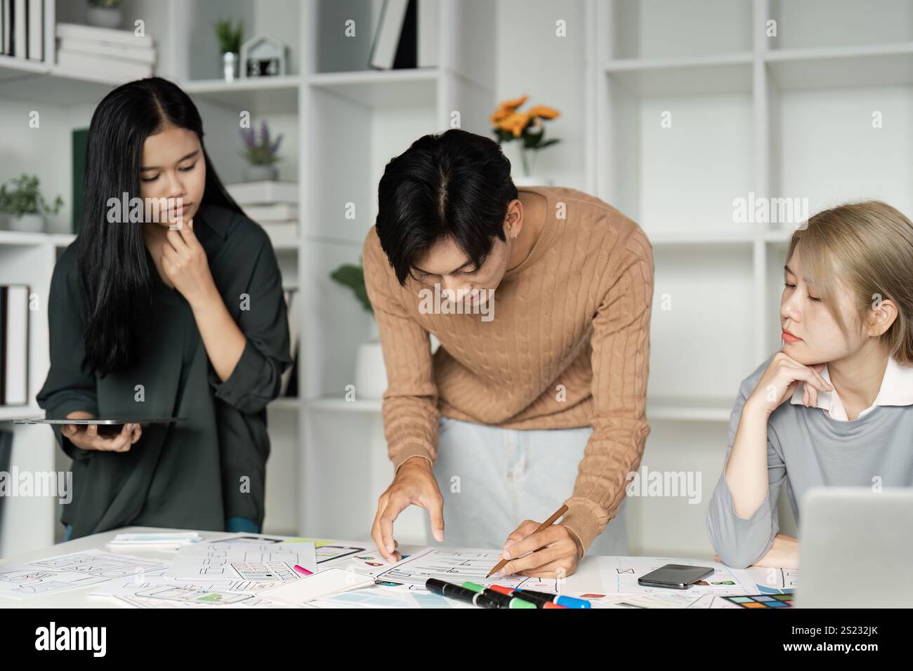 Creative Team Collaborating On Ux Ui Design For Business Solutions In Modern Office Environment