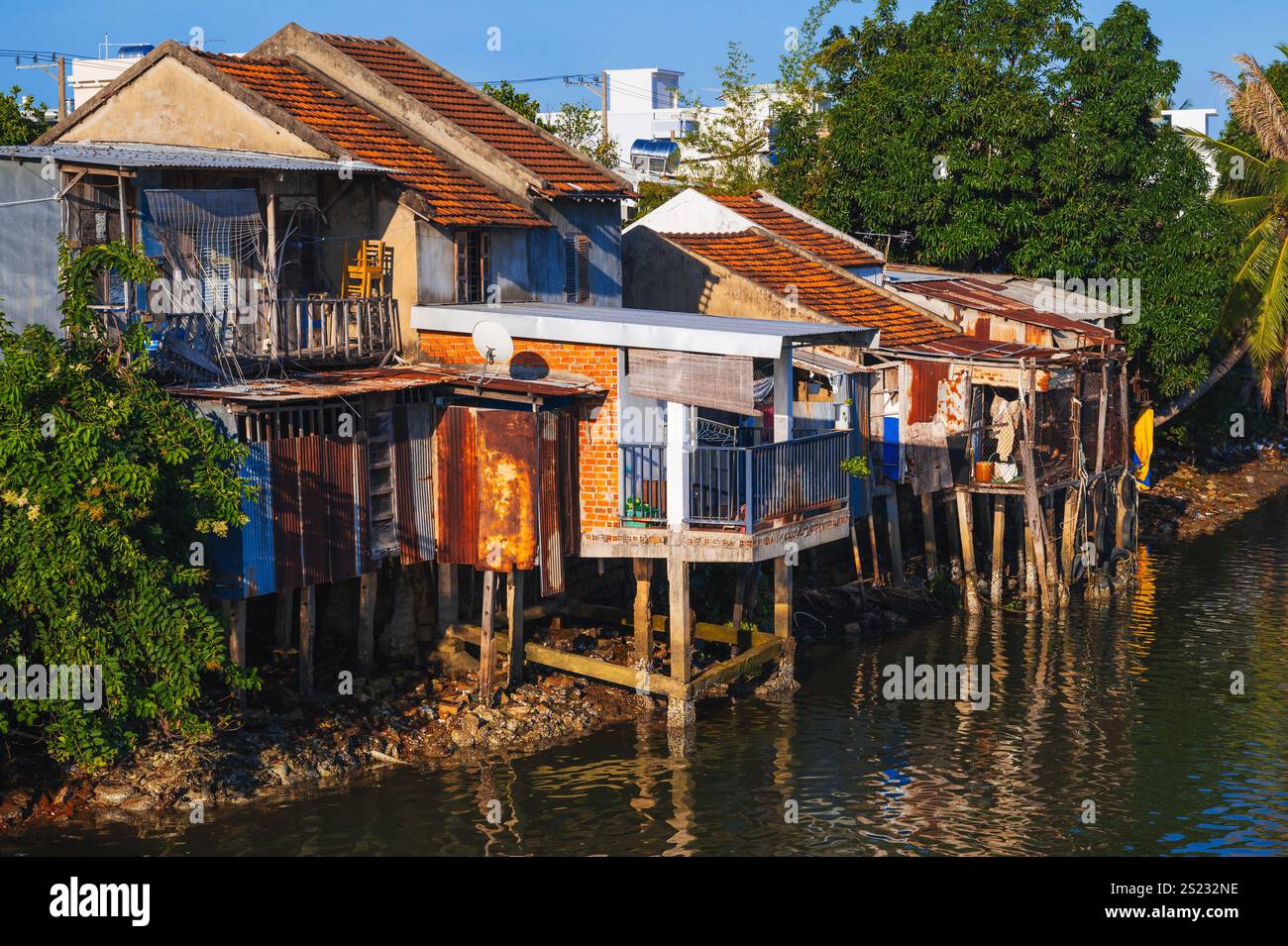Vietnamese houses standing on stilts in the river. Nha Trang, Vietnam ...
