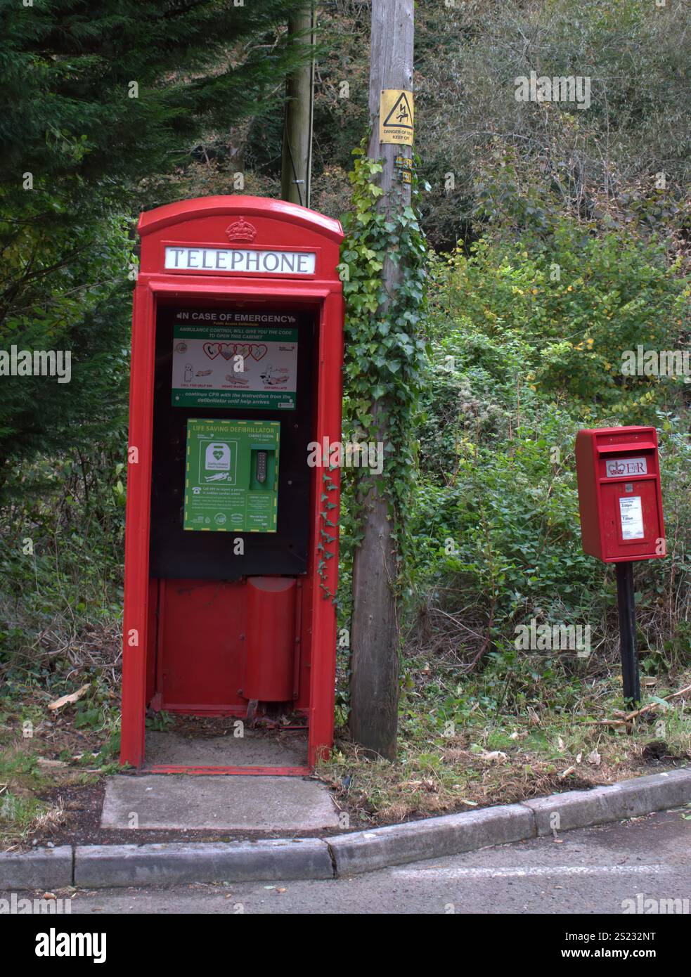 Sandplace, Cornwall, UK - October 23, 2021: Red telephone box near Looe ...