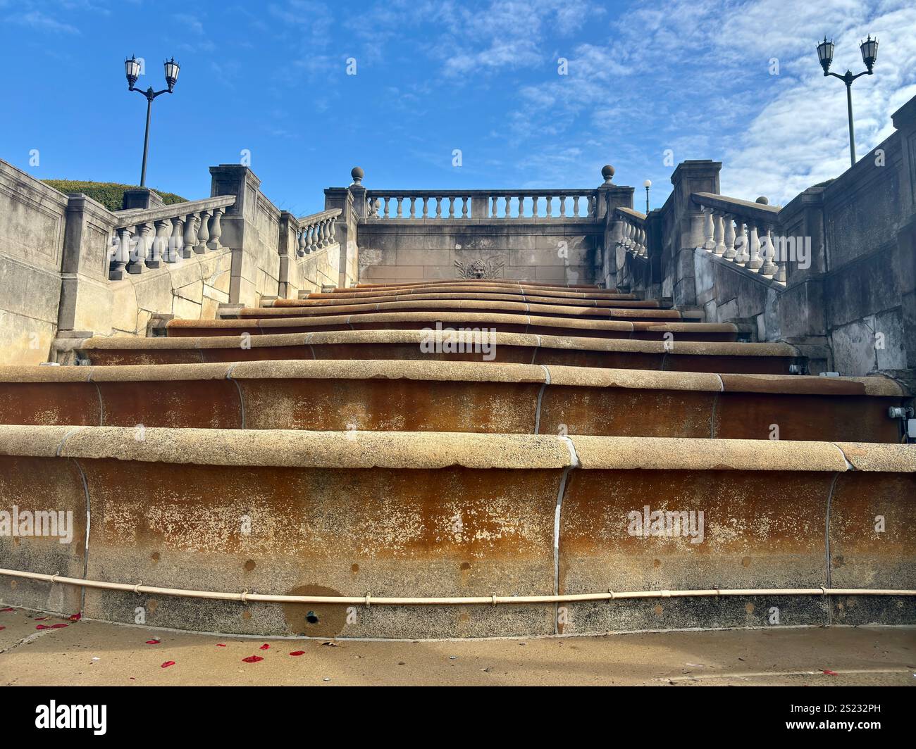 View of aged stone fountain with decorative railings Stock Photo - Alamy