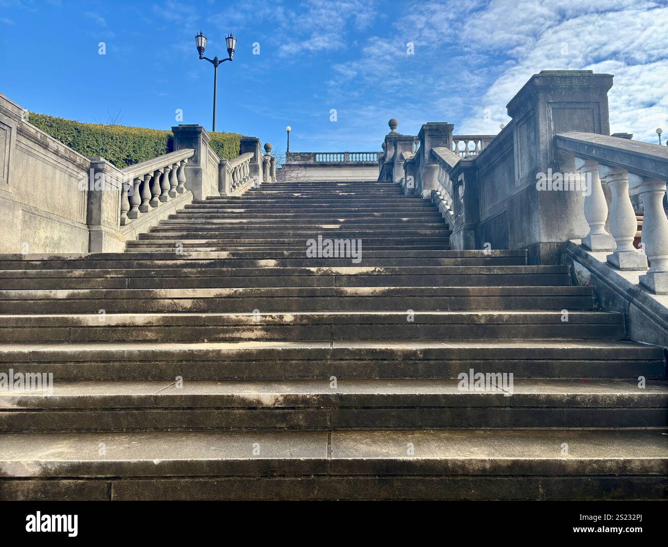 Grand stone staircase with ornate balustrades leading upwards Stock ...