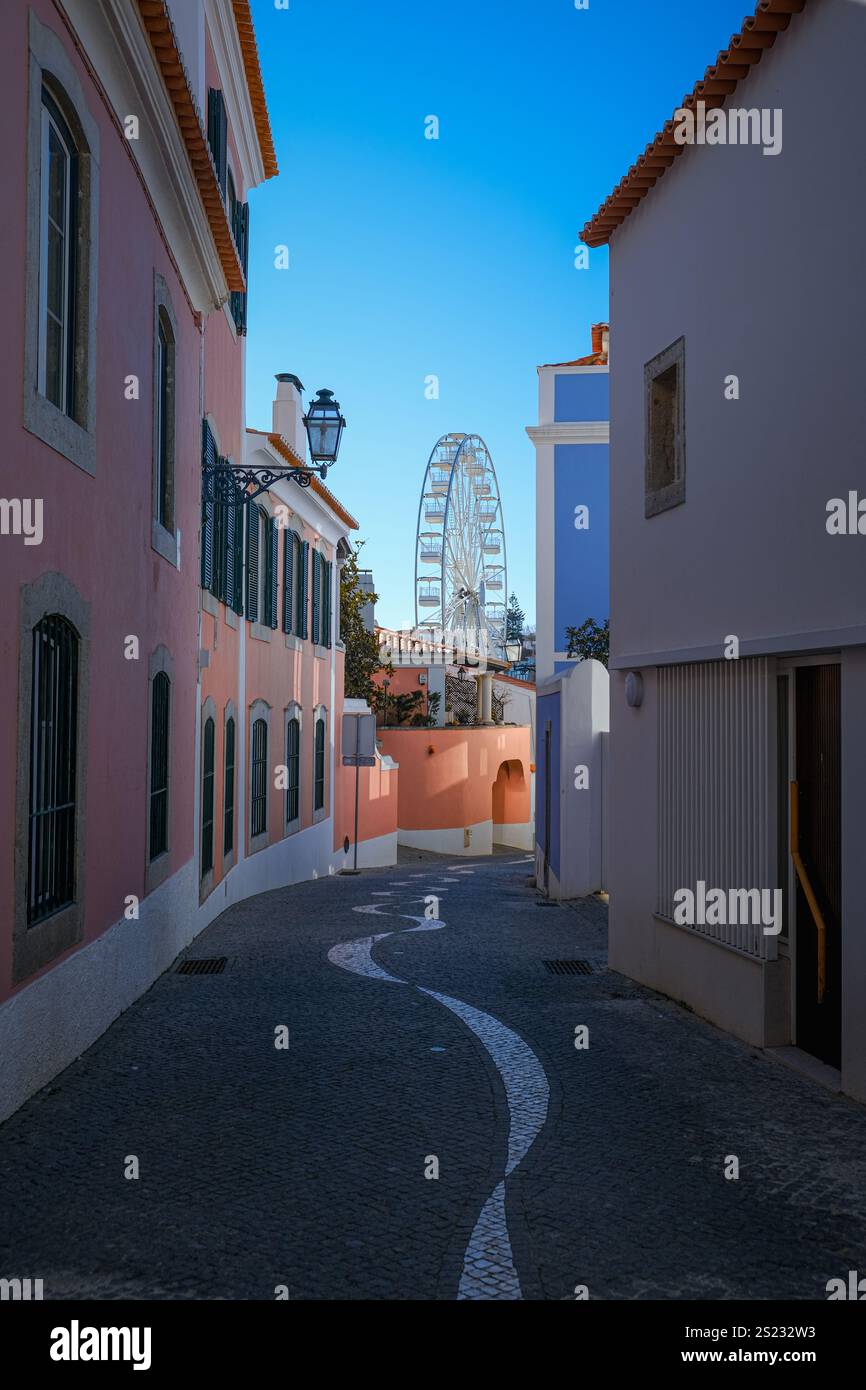 Typical street in Portugal with a ferris wheel in the background Stock ...