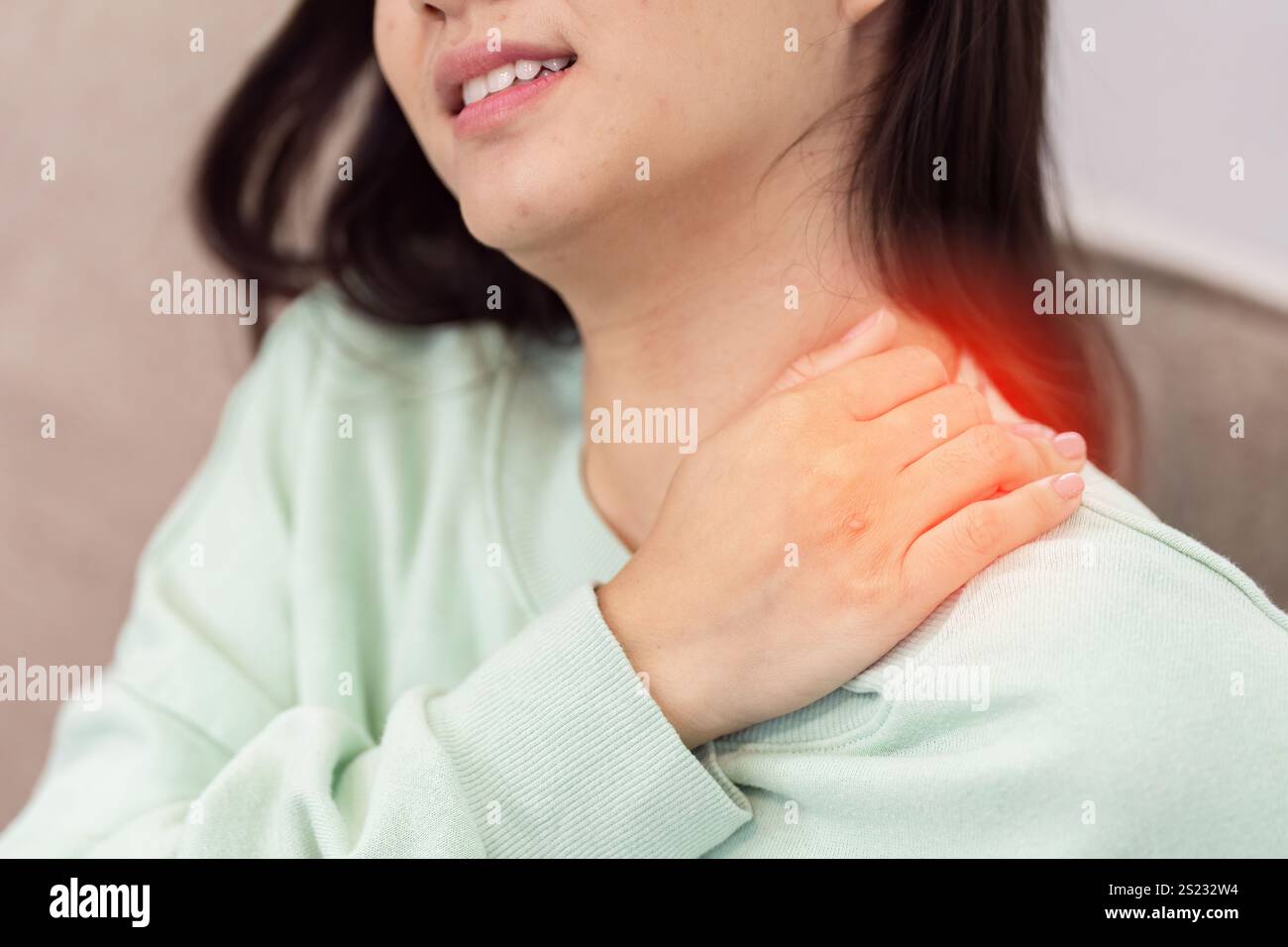 Woman Experiencing Shoulder Pain at Home, Highlighting Discomfort and ...