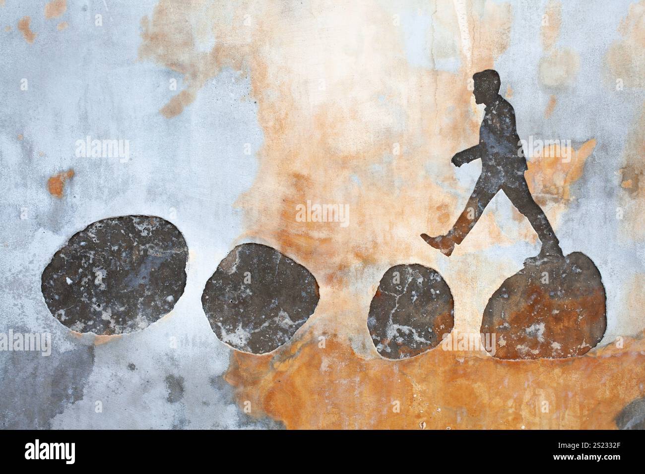 Man walking across rocks hi-res stock photography and images - Alamy