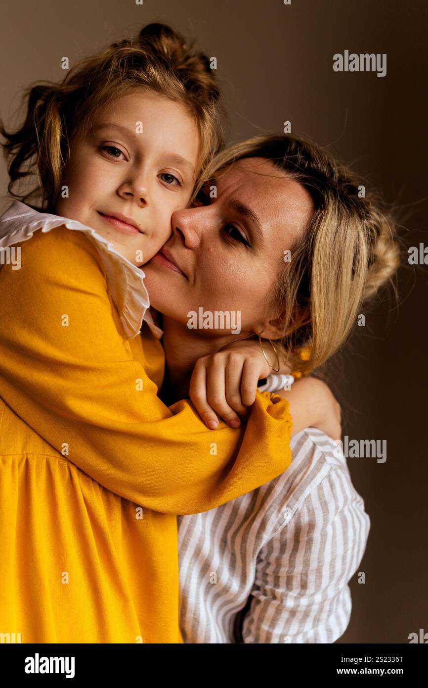 Mom and daughter hugging and laughing Stock Photo - Alamy