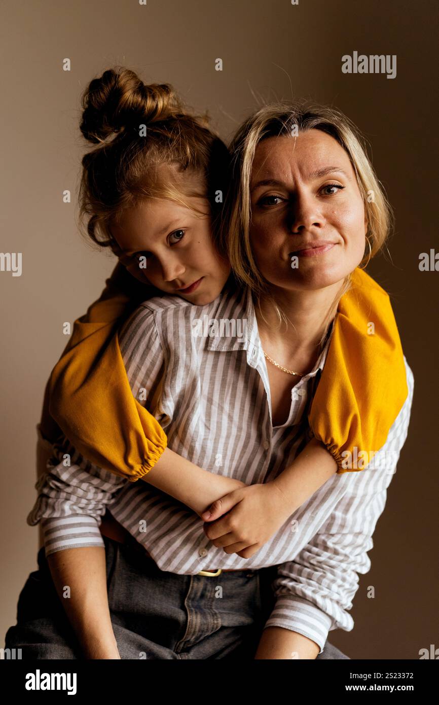 Mom and daughter hugging and laughing Stock Photo - Alamy