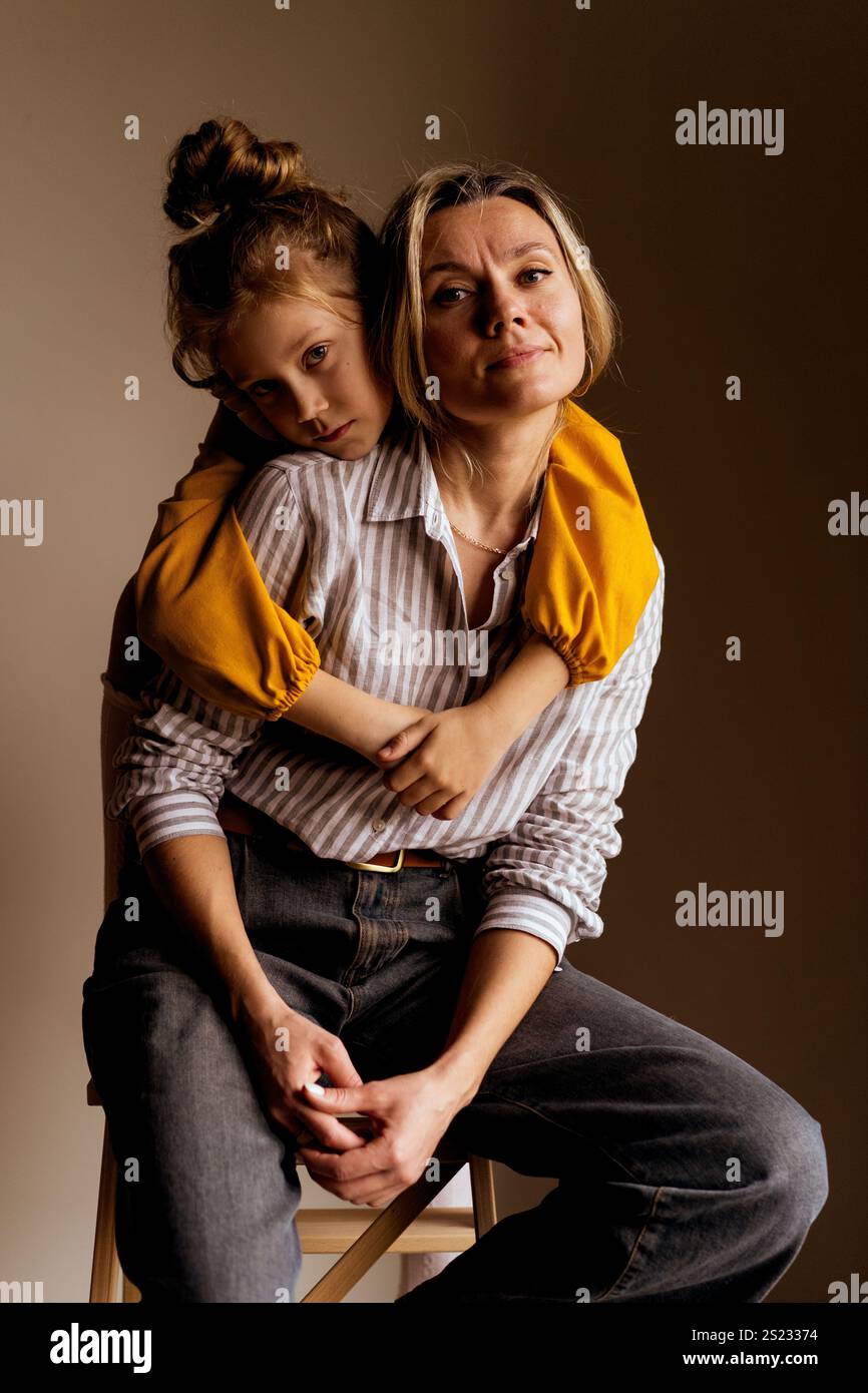 Mom and daughter hugging and laughing Stock Photo - Alamy