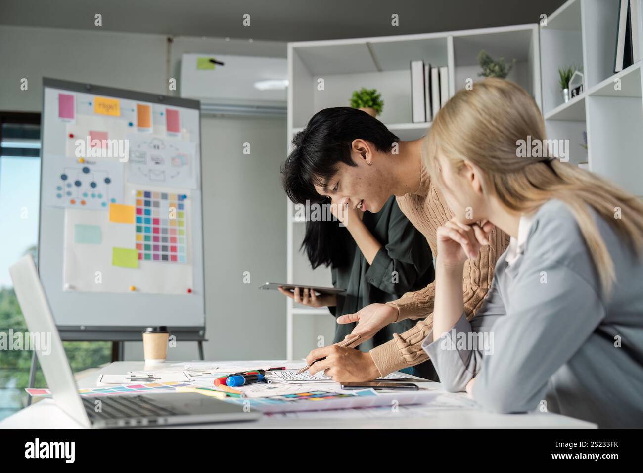 Creative Team Collaborating On Ux Ui Design For Business Solutions In Modern Office Environment