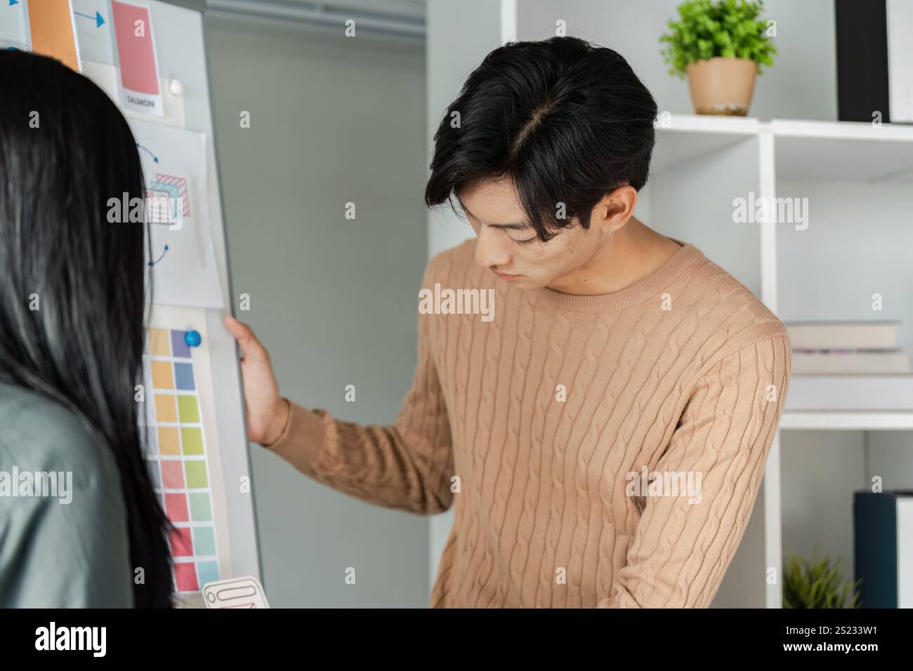 Young Professionals Collaborating On Ux Ui Design In Modern Office Environment For Business