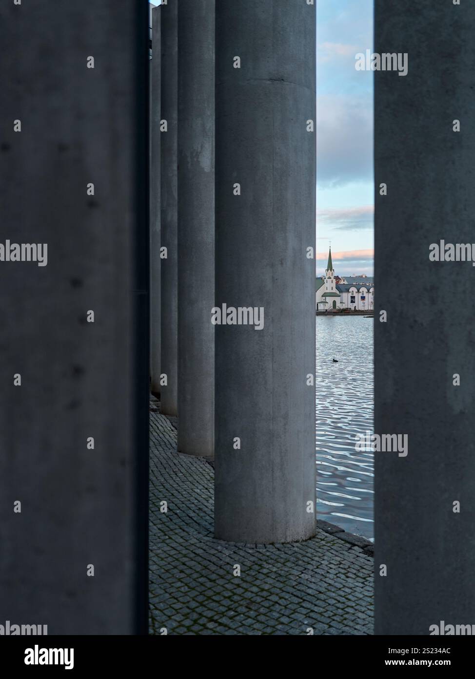 View of church through columns at sundown Stock Photo - Alamy