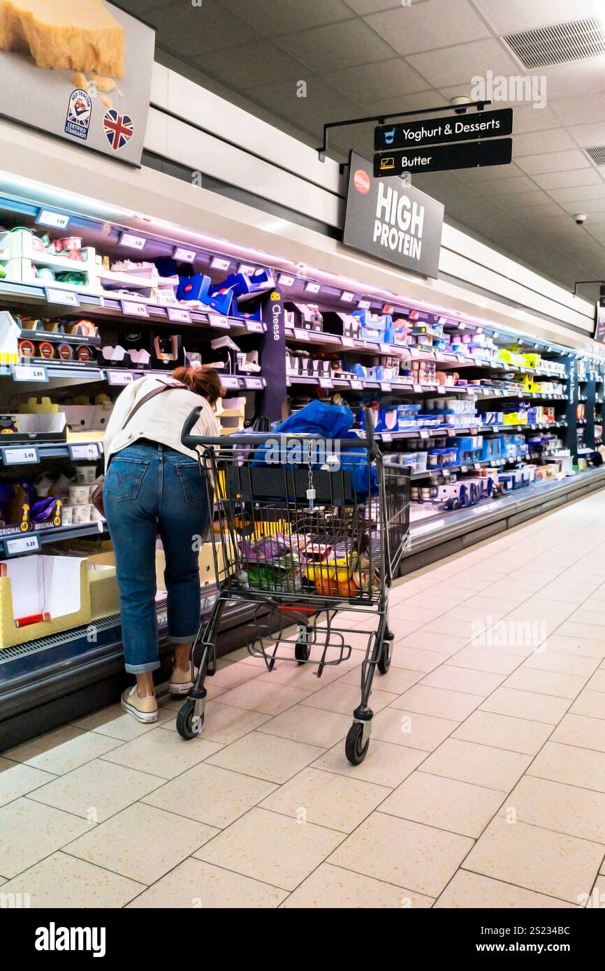 Shopper person shopping inside a Lidl shop store in England in the UK ...