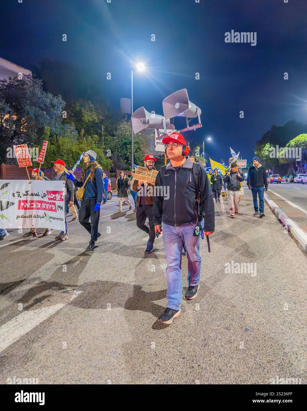 Haifa, Israel - January 04, 2025: People take part in a protest march ...