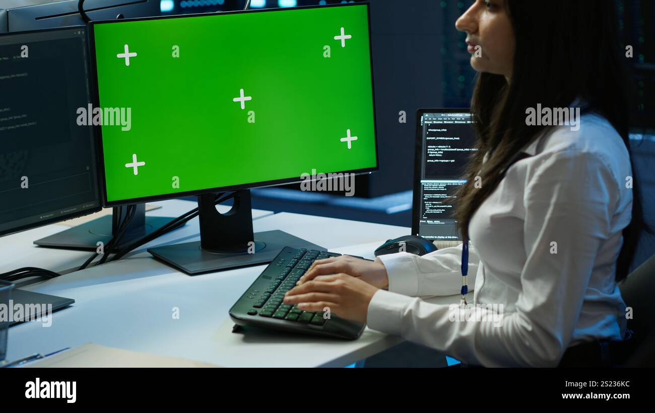 System Administrator In Data Center Installing Software On Green Screen Computer