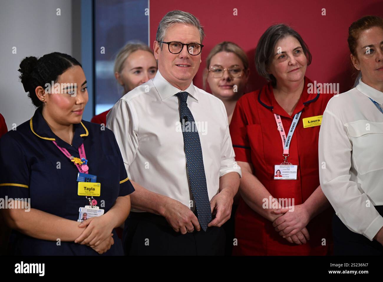 Britain's Prime Minister Keir Starmer, center, visits a healthcare ...